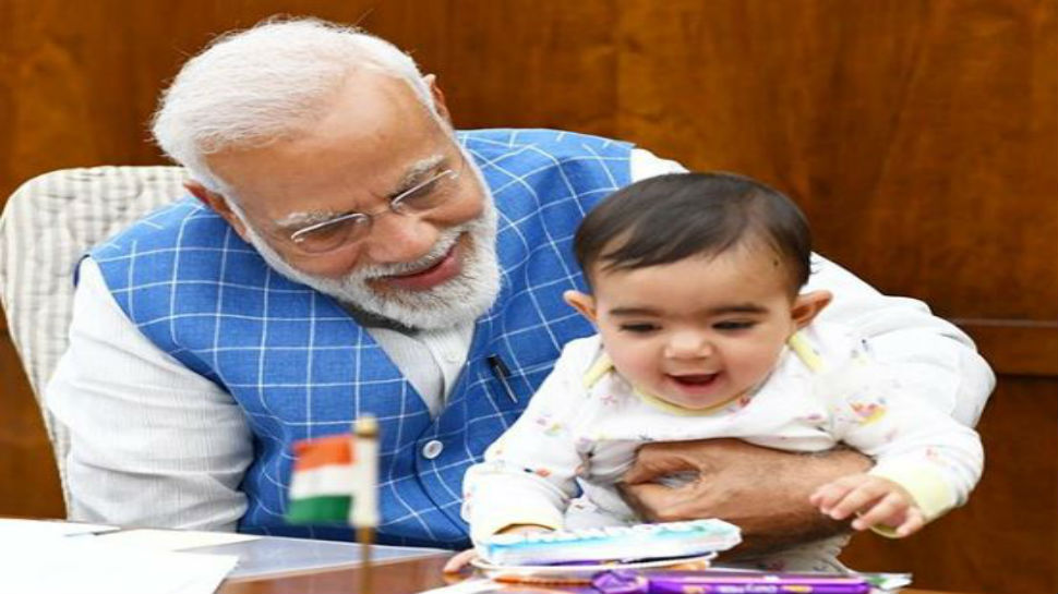 Prime Minister Narendra Modi playing with baby in Parliament photos ...