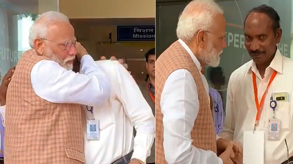 PM Narendra Modi hugged and consoled ISRO Chief K Sivan when he broke ... PM Narendra Modi hugged and consoled ISRO Chief K Sivan when he broke ...