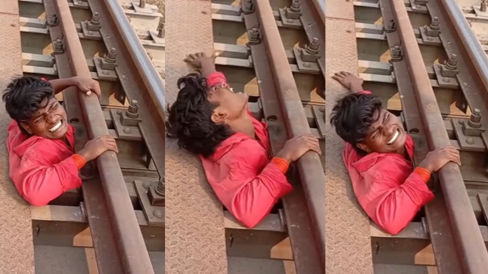 Viral video of a man stuck badly on railway track fighting to come out ...